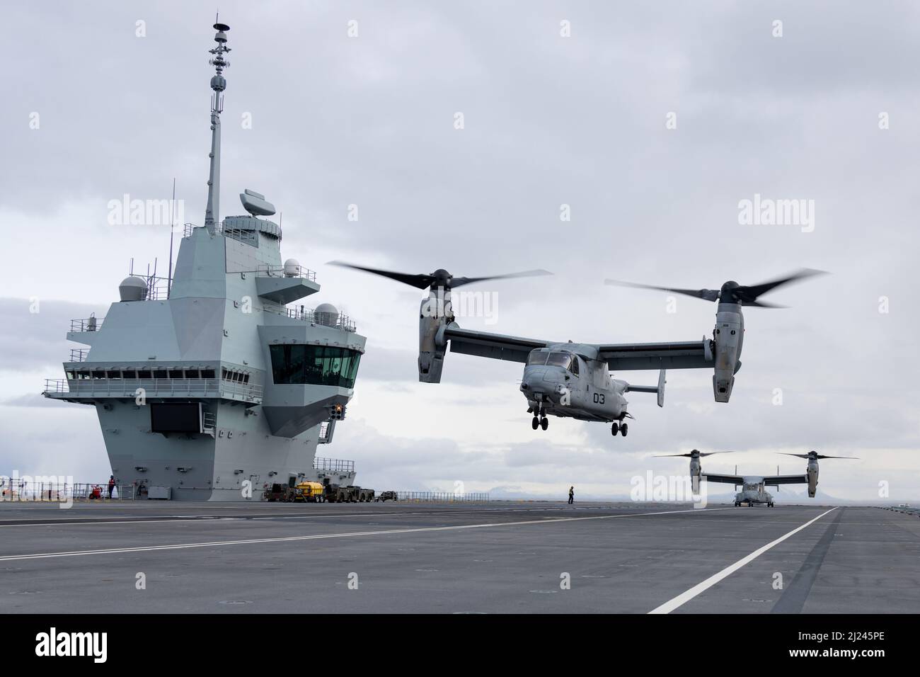 U.S. Marines land two MV-22B Ospreys on the HMS Prince of Wales during Exercise Cold Response ...