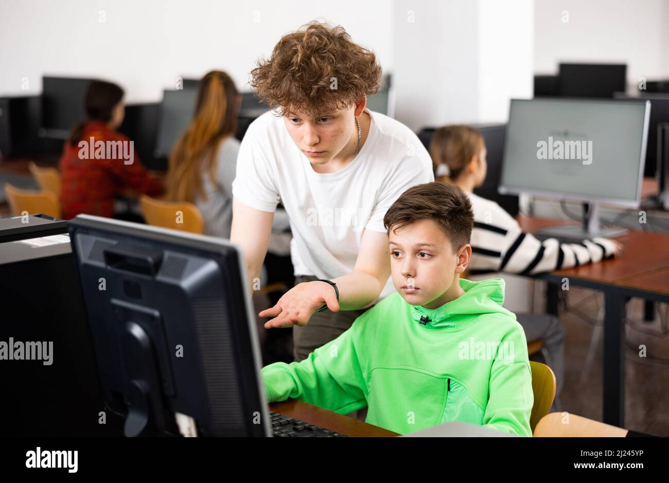 Child helps friend hi-res stock photography and images - Alamy