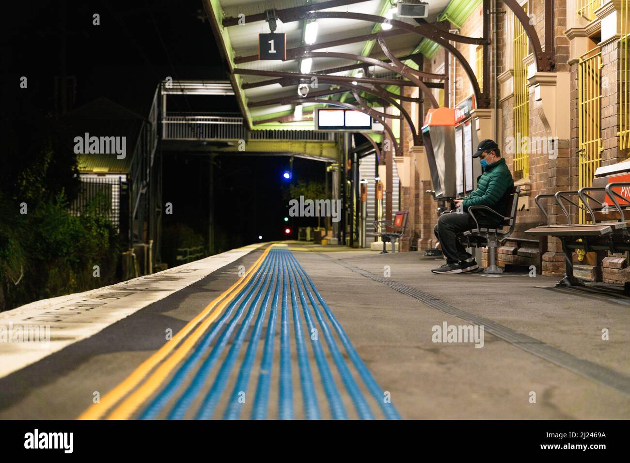 A Man Waiting for a Train Stock Photo - Alamy