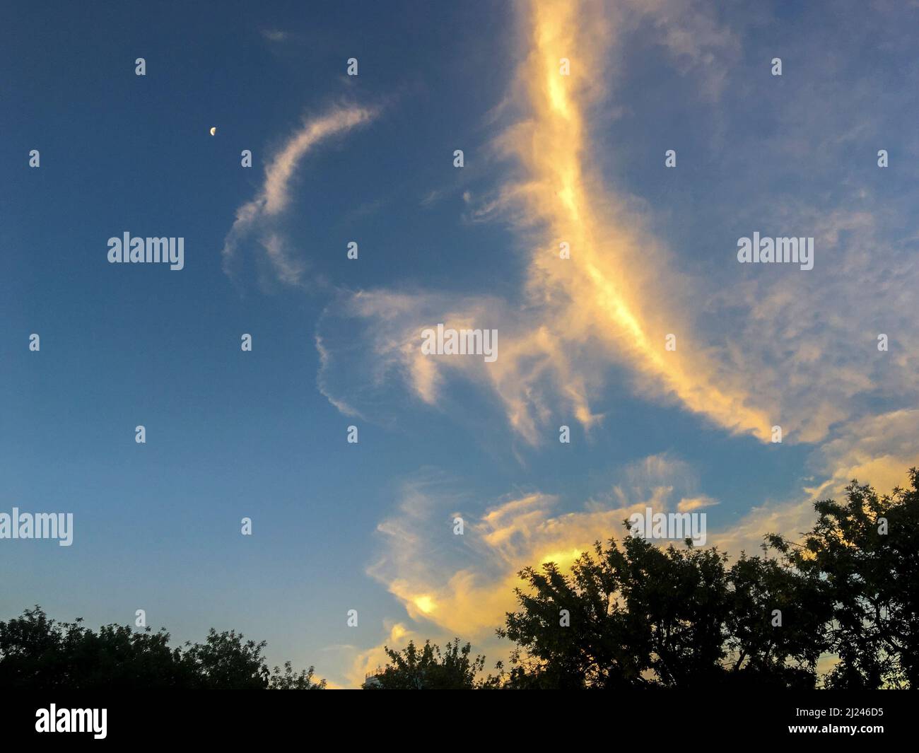 Swirl clouds in blue hi-res stock photography and images - Alamy