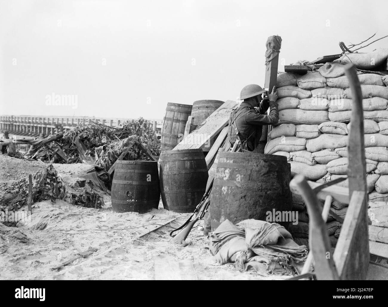 Left hand man of the British Army looking over the breastwork parapet ...