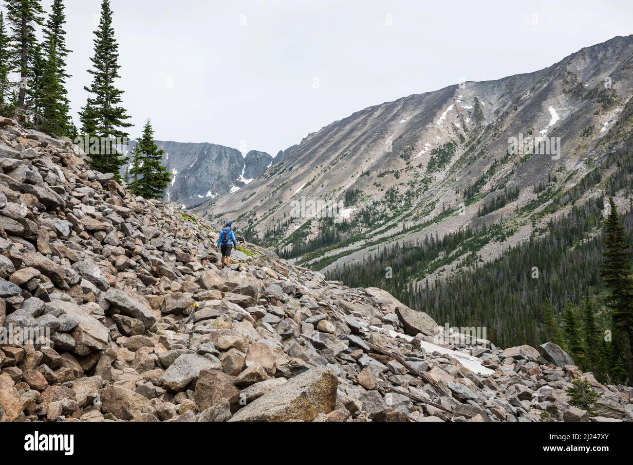 A man hiking in the Crazy Mountains near Blue Lake, Montana, USA Stock ...