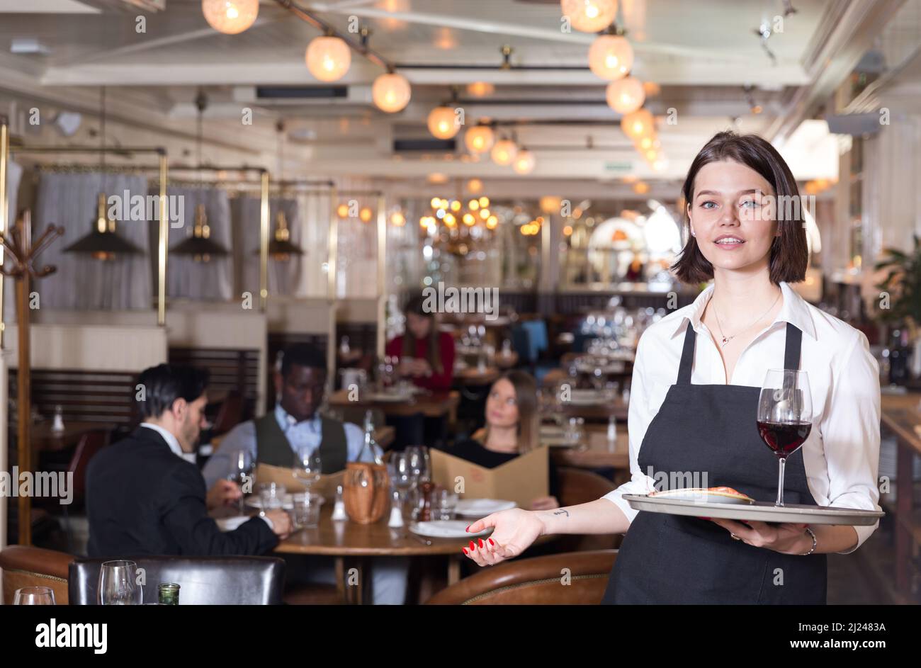 Waitress with serving tray Stock Photo - Alamy