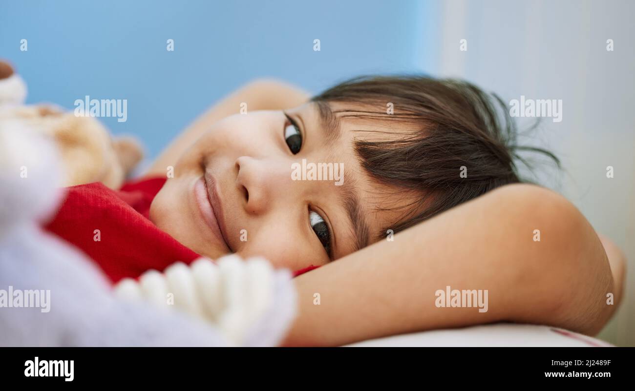 Time to rest, then its time to play again. Portrait of an adorable ...