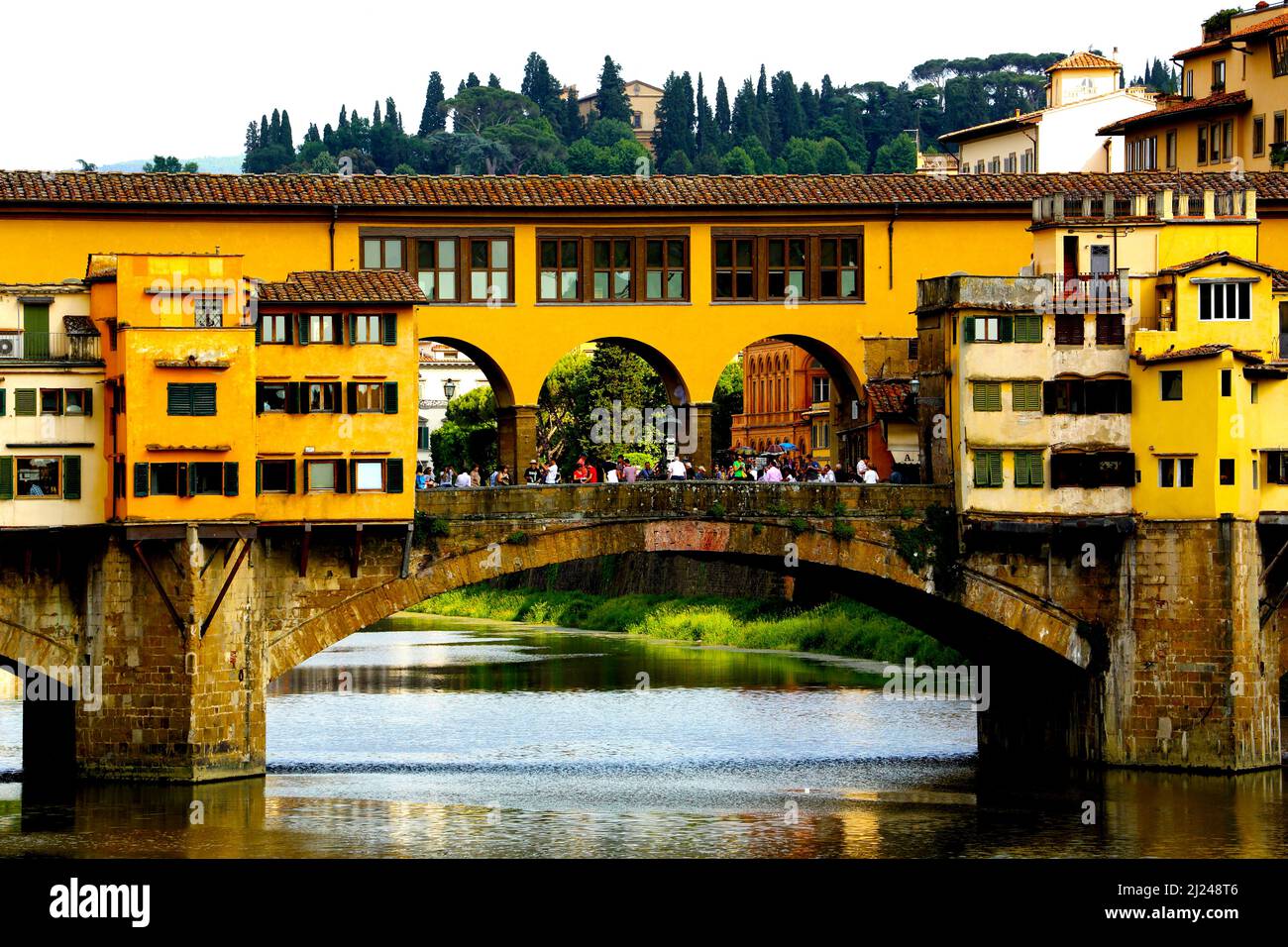 The Ponte Vecchio is an iconic historic bridge in Florence Italy Stock ...