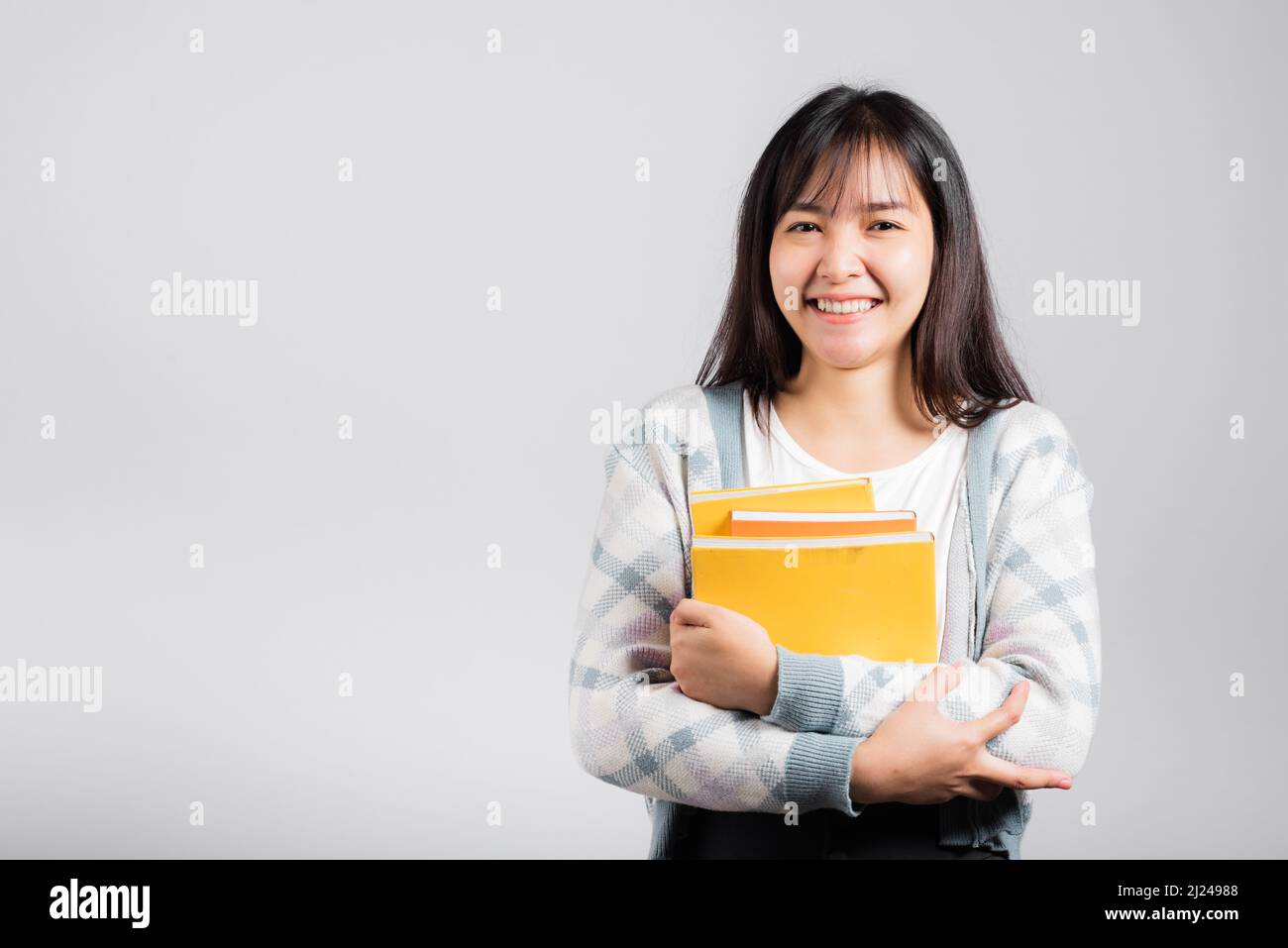 Woman teen smiling holding and hug embrace favorite book for lover ...