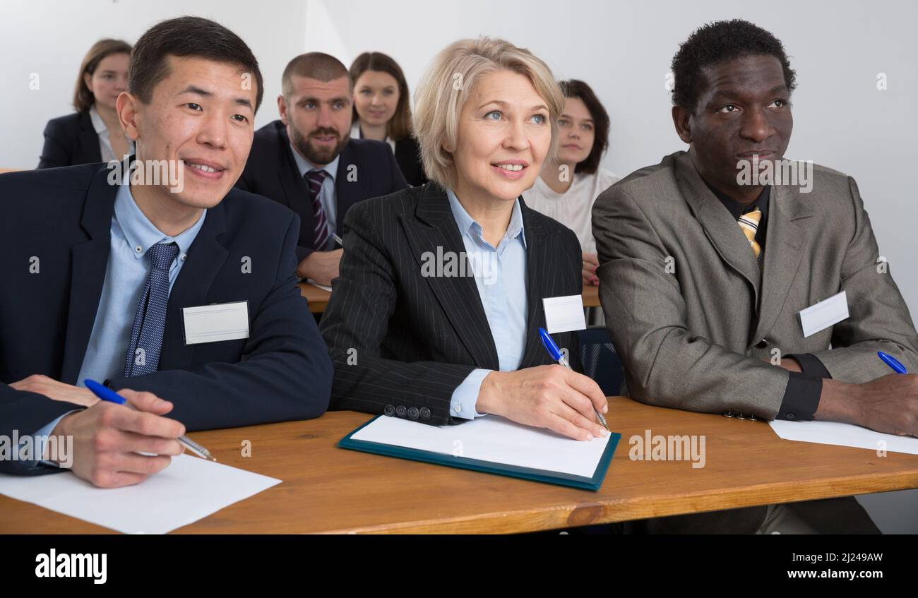 People during business seminar in lecture hall Stock Photo - Alamy