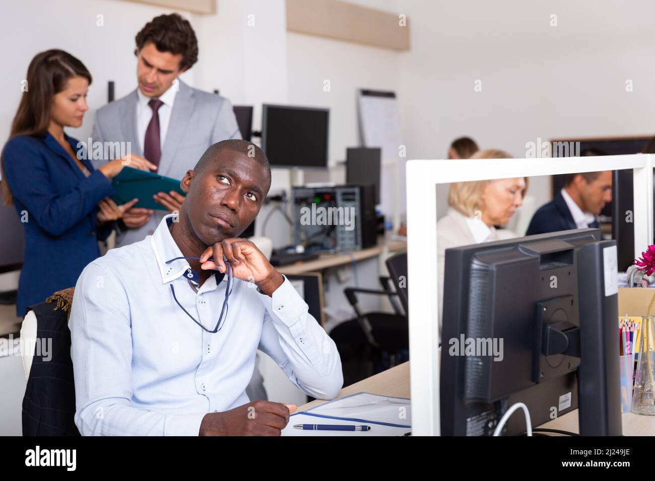 African American office worker on his workplace Stock Photo - Alamy