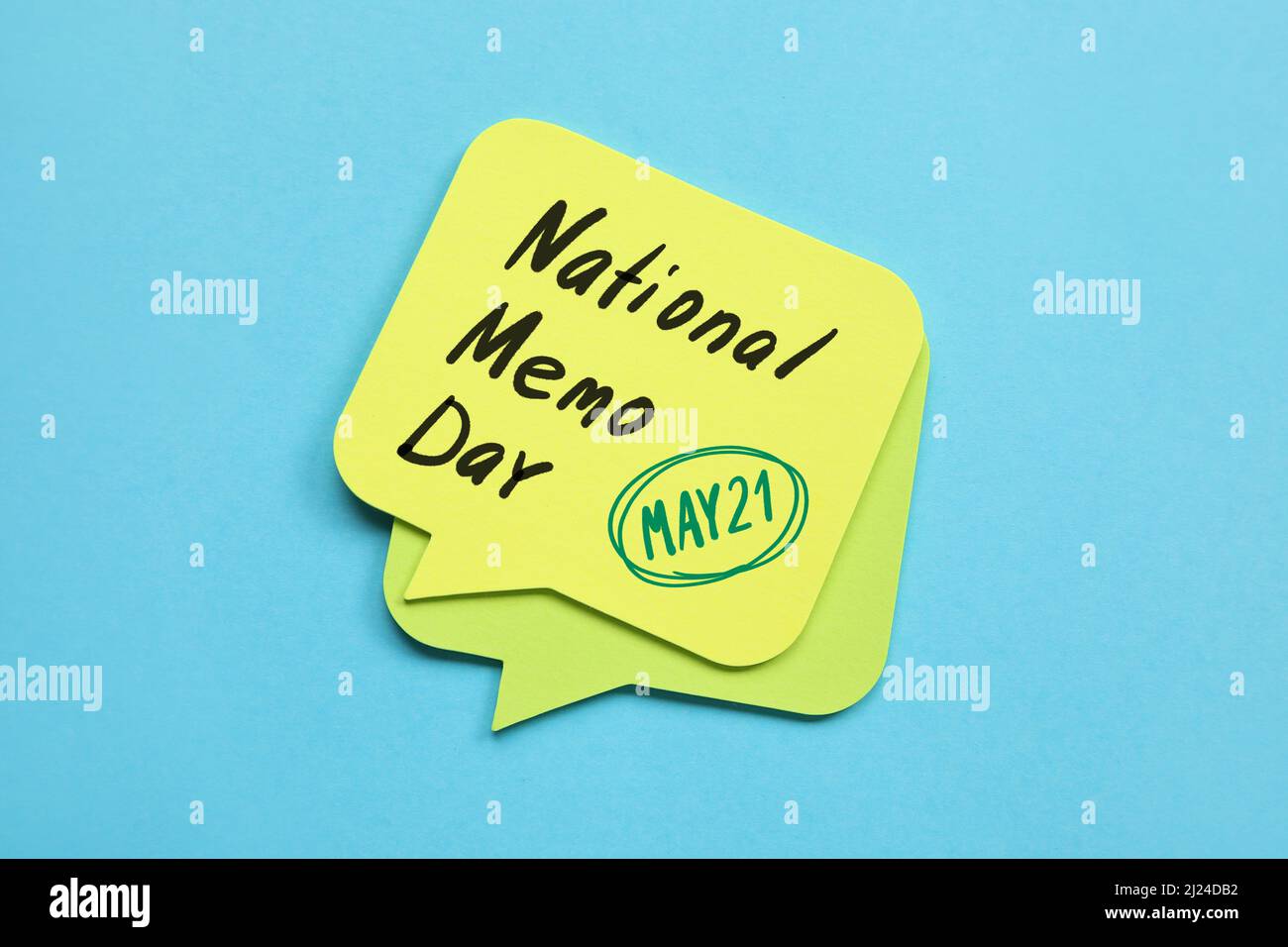 Sticky note with text NATIONAL MEMO DAY. MAY 21 on blue background ...