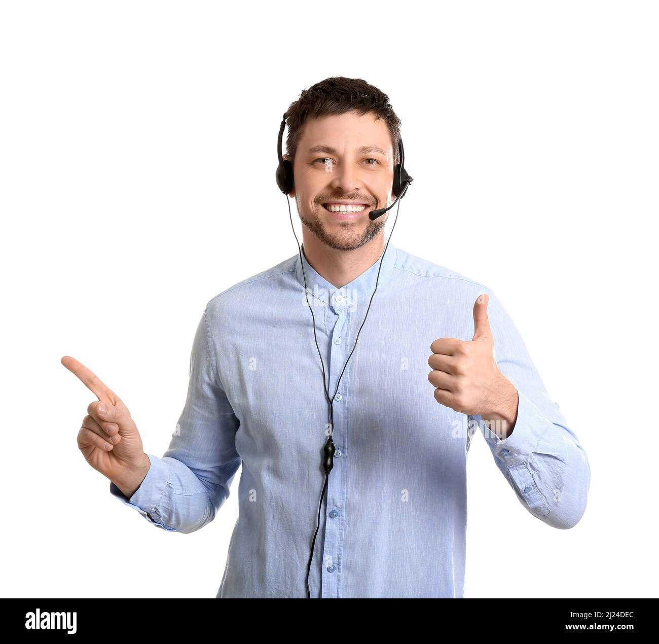 Consultant of call center in headset showing thumb-up and pointing at ...