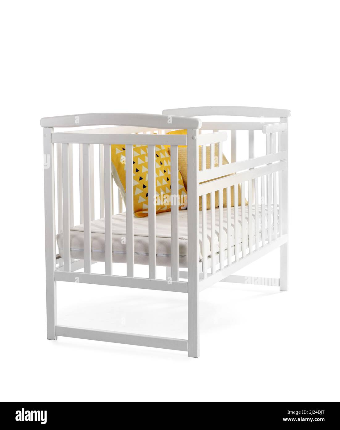 Baby crib with yellow pillows on white background Stock Photo - Alamy
