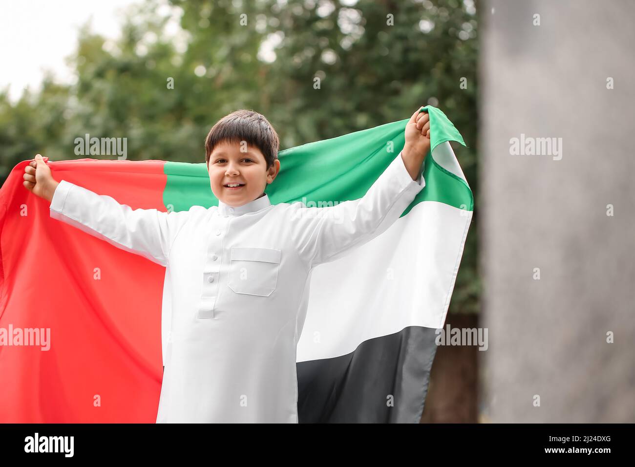 Cute little boy with national flag of UAE outdoors Stock Photo - Alamy