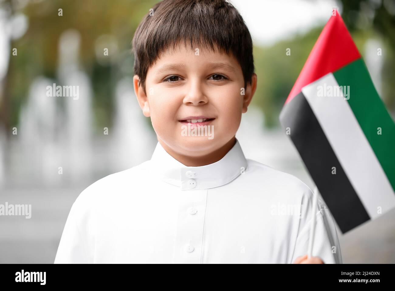 Cute little boy with national flag of UAE outdoors Stock Photo - Alamy