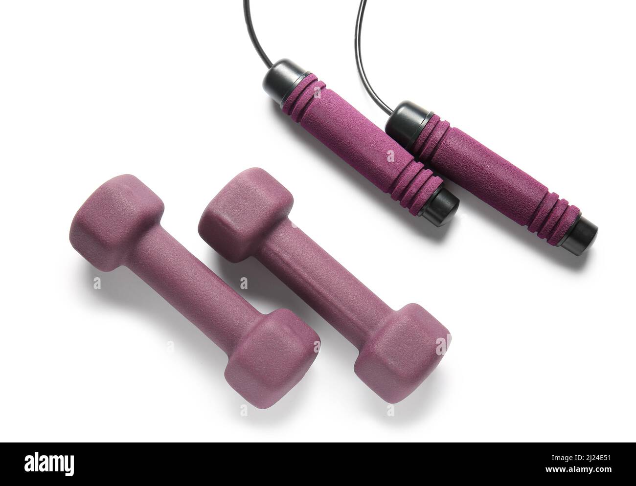 Stylish dumbbells and skipping rope on white background Stock Photo - Alamy