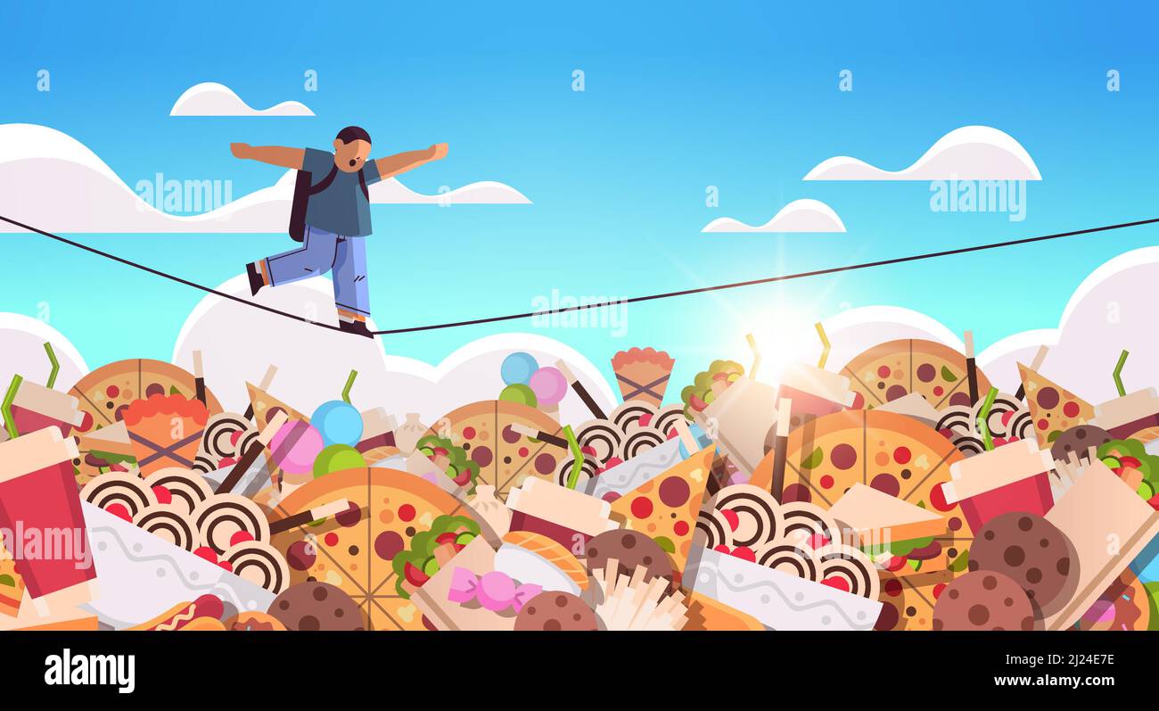 schoolboy balancing on rope above junk food assortment of fast food ...