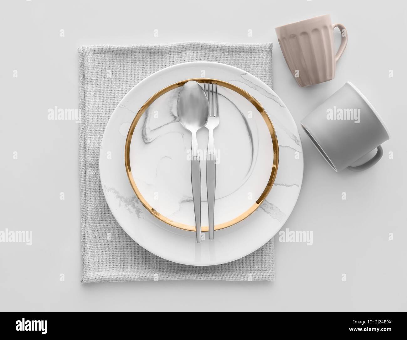Set of beautiful dinnerware on light background Stock Photo - Alamy