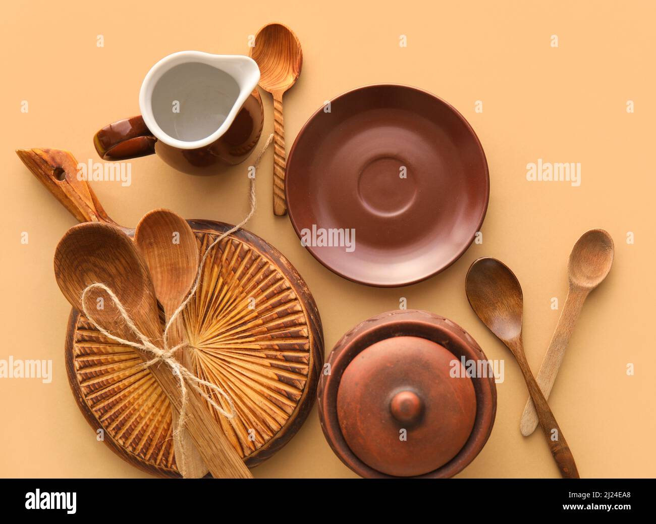 Set of stylish dinnerware on beige background Stock Photo - Alamy