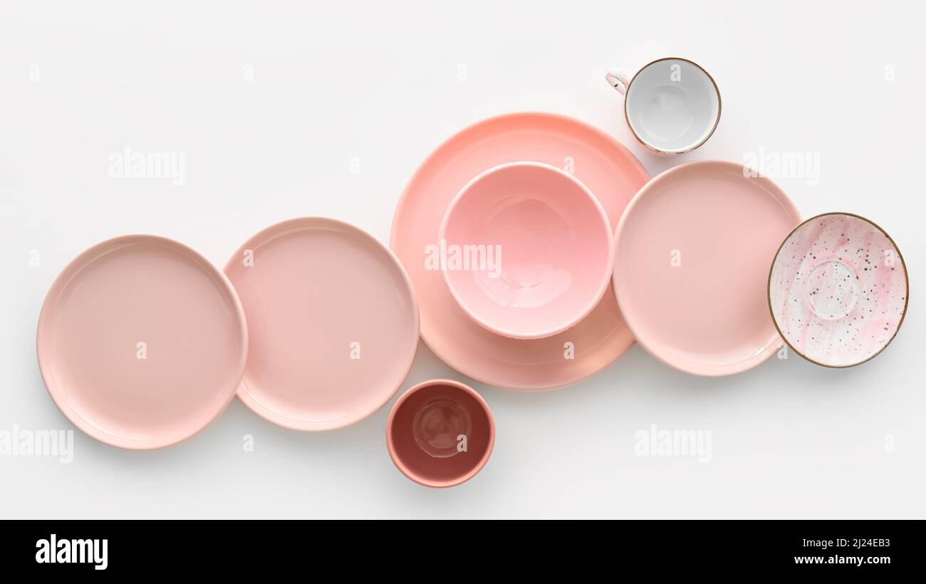 Set of stylish dinnerware on white background Stock Photo - Alamy