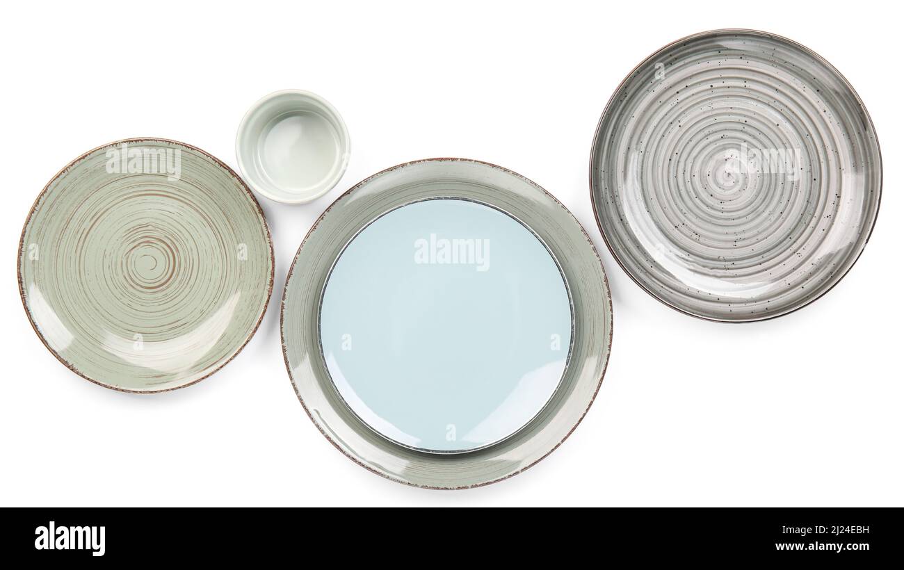 Set of stylish dinnerware on white background Stock Photo - Alamy