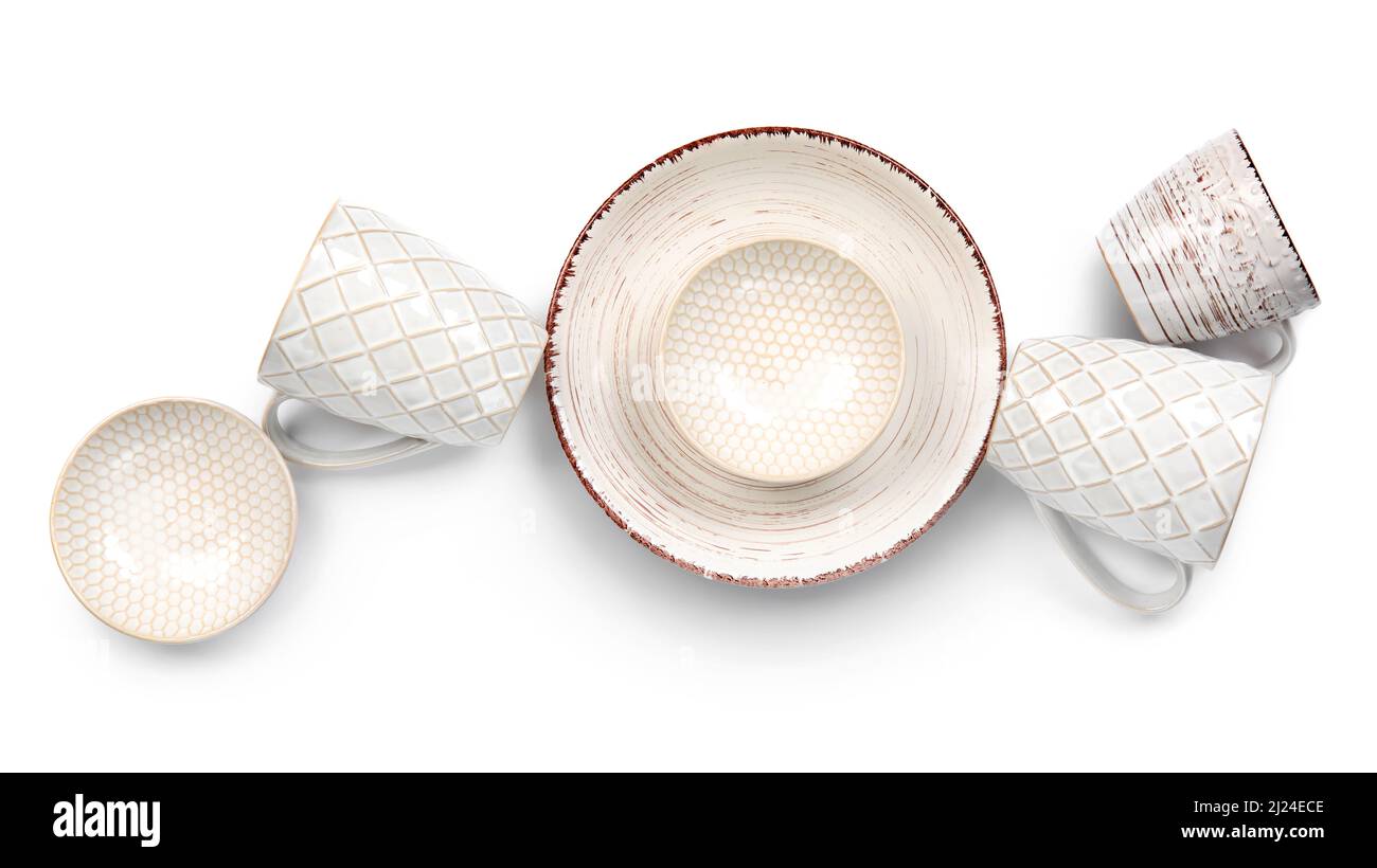 Set of stylish dinnerware on white background Stock Photo - Alamy