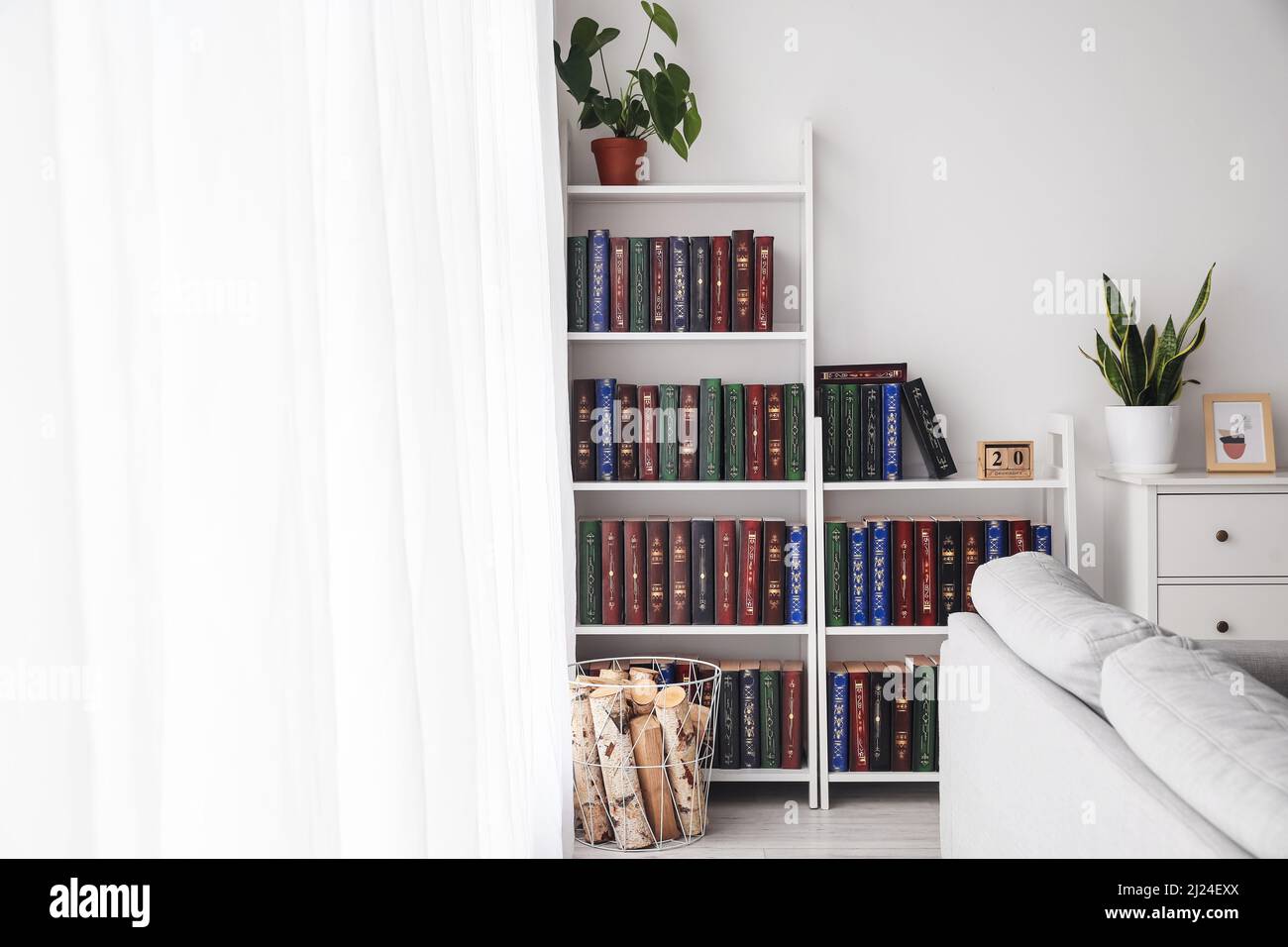 Bookcase in modern interior of room Stock Photo - Alamy