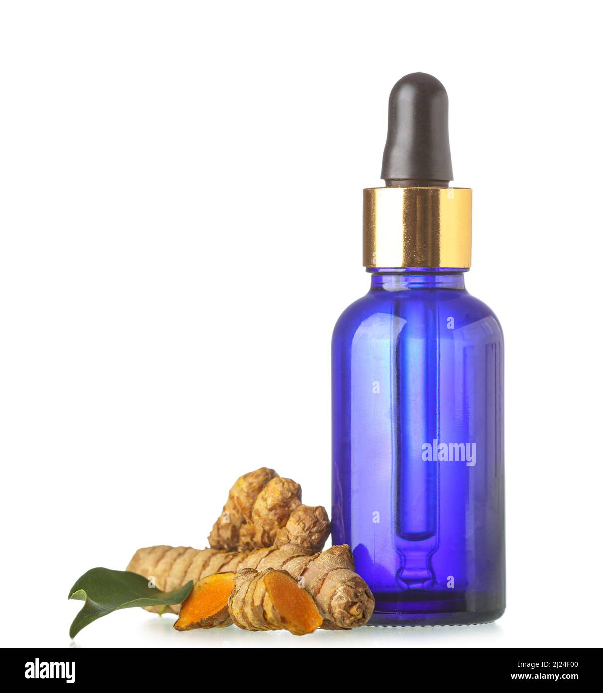 Bottle of oil and turmeric root on white background Stock Photo - Alamy