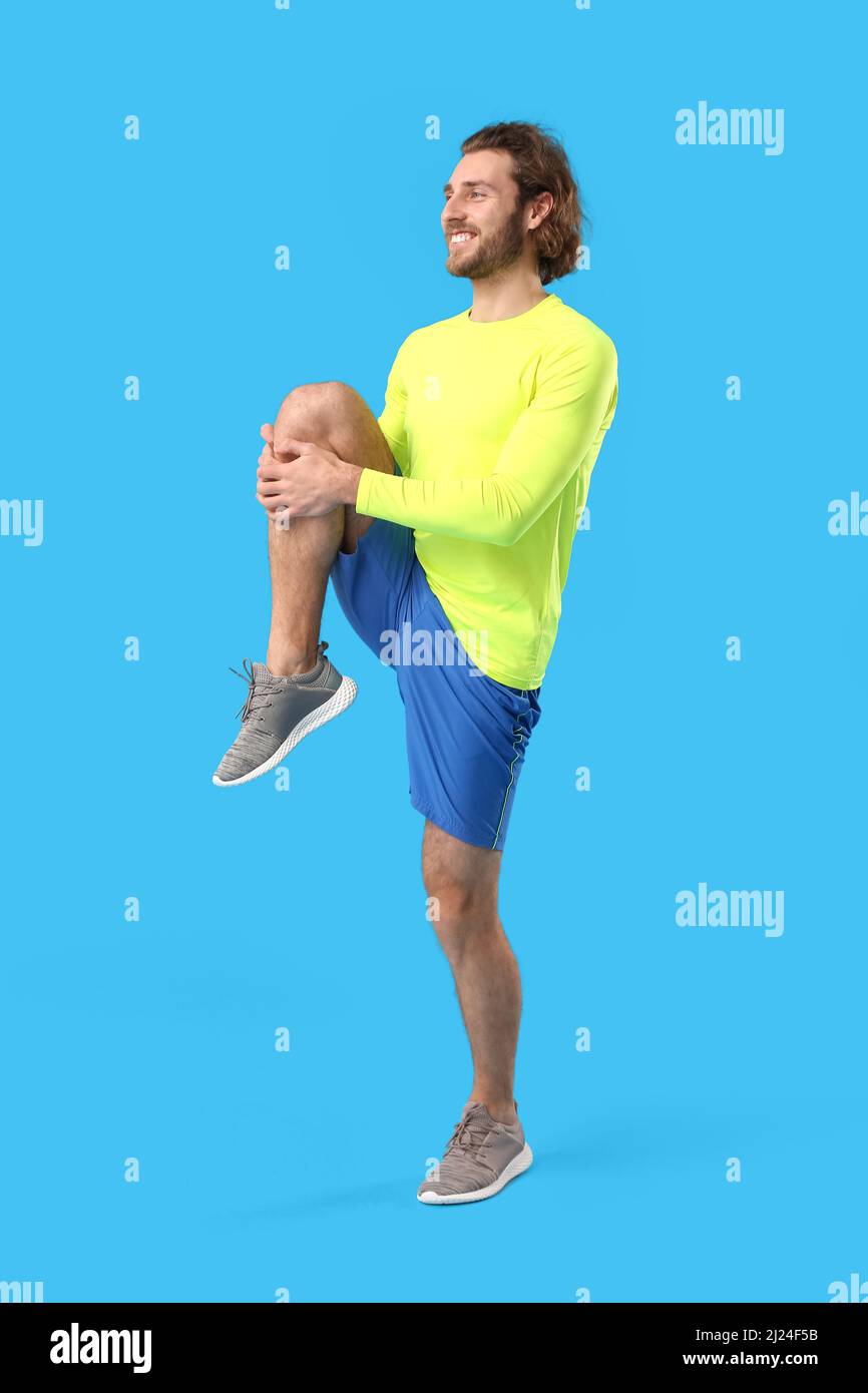 Handsome guy stretching muscles legs hi-res stock photography and ...