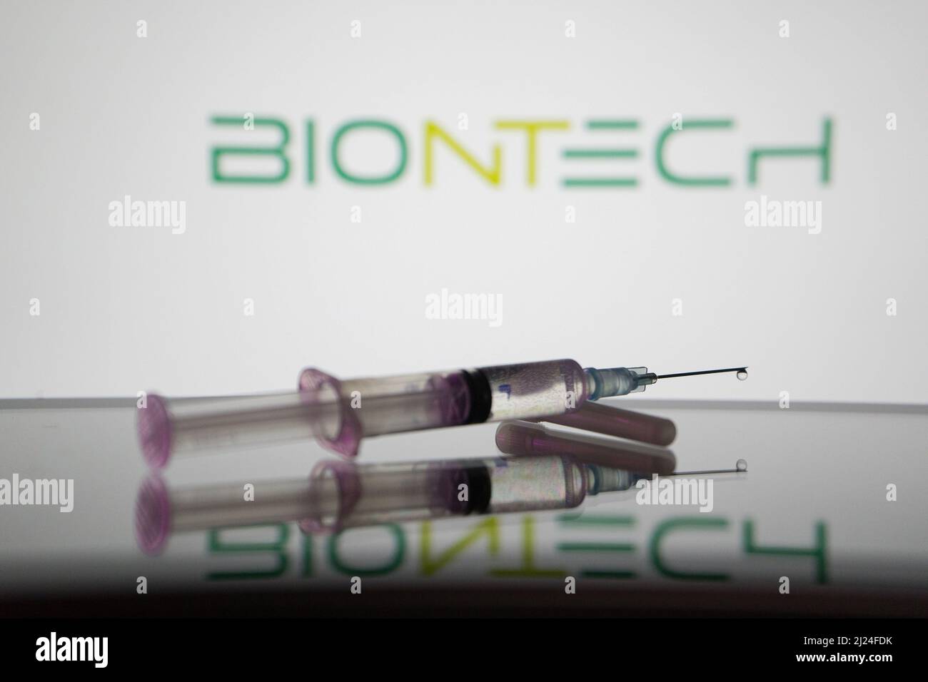 In this photo illustration, a medical syringe seen displayed on a ...