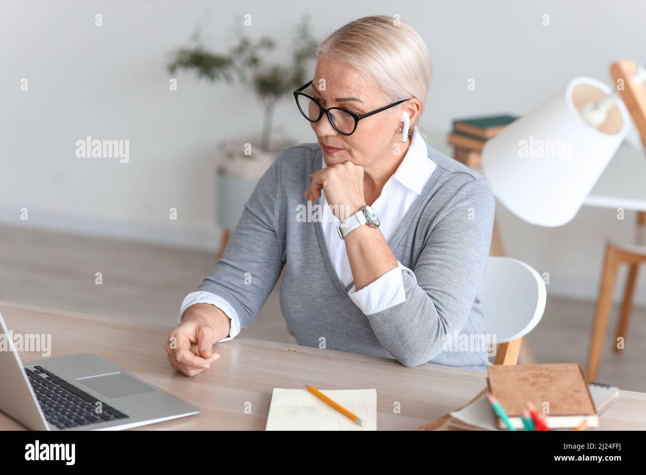 Female tutor giving lesson online Stock Photo - Alamy