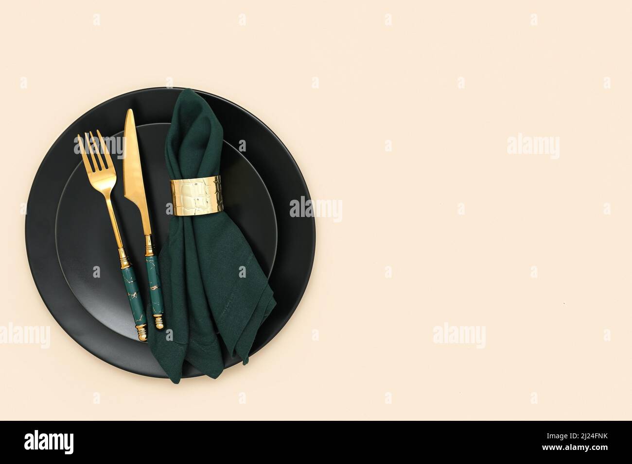 Simple table setting on beige background Stock Photo - Alamy