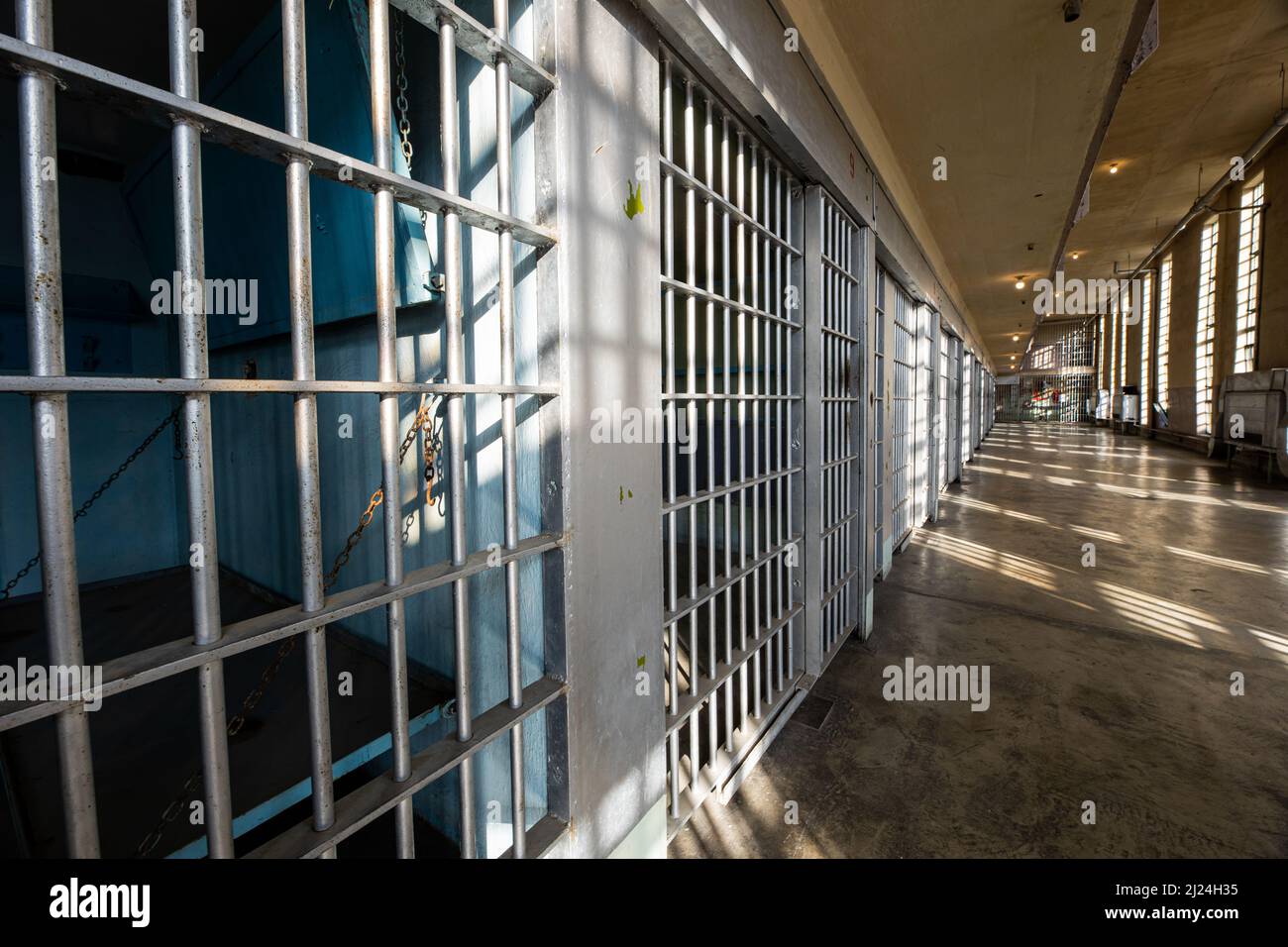 sun and shadows form on the bars of a prison Stock Photo - Alamy