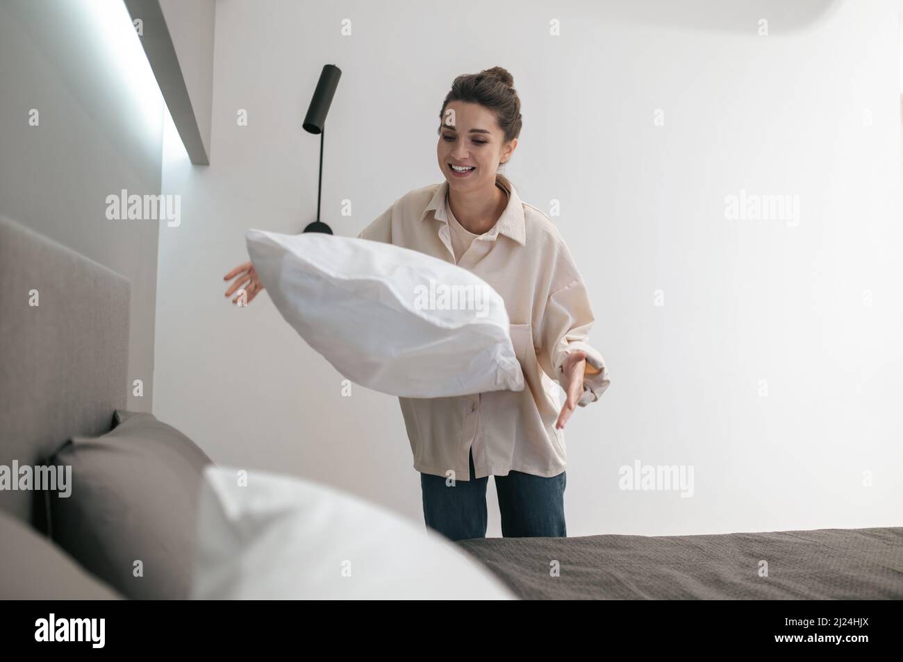 Household housewife making bed hi-res stock photography and images - Alamy