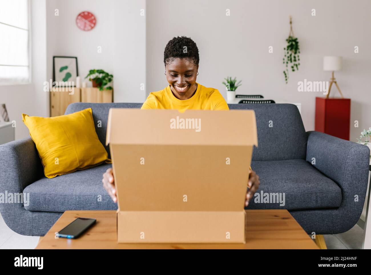 Unpacking the package hi-res stock photography and images - Alamy