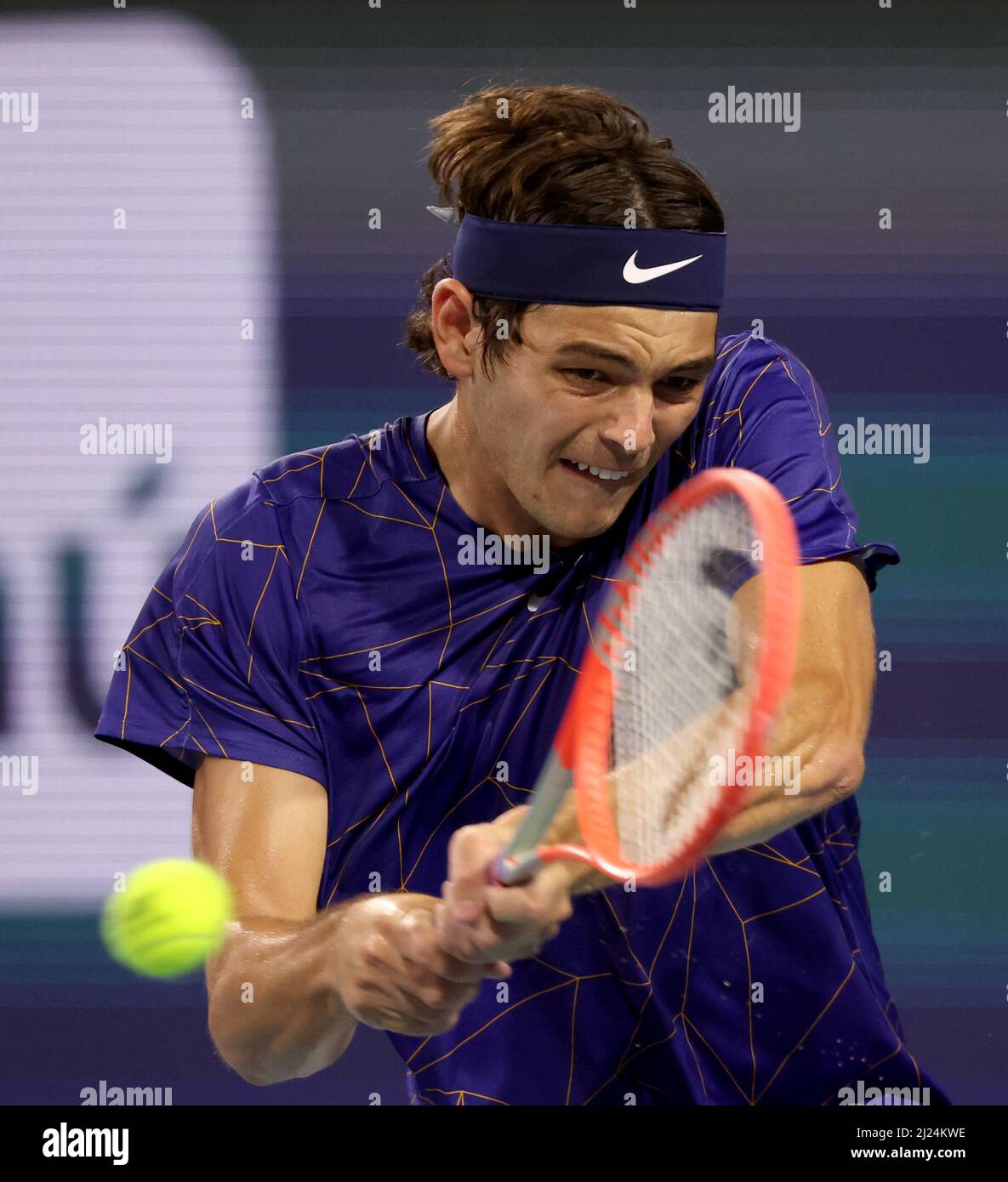 MIAMI GARDENS, FLORIDA - MARCH 29: Miomir Kecmanovic of Serbia defeats Taylor Fritz of the ...