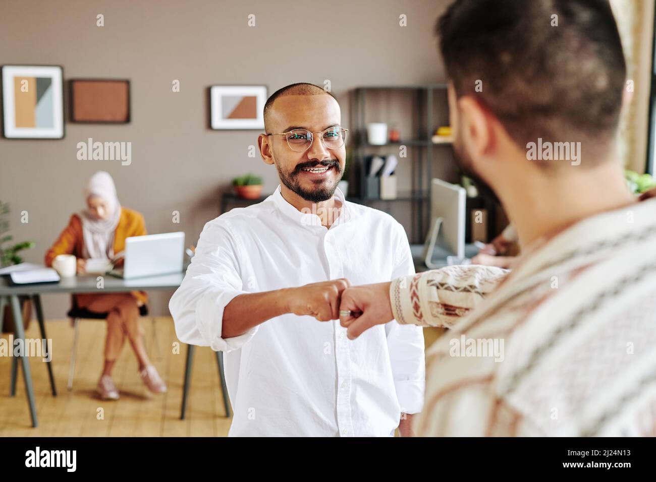 Office work team greeting hi-res stock photography and images - Alamy