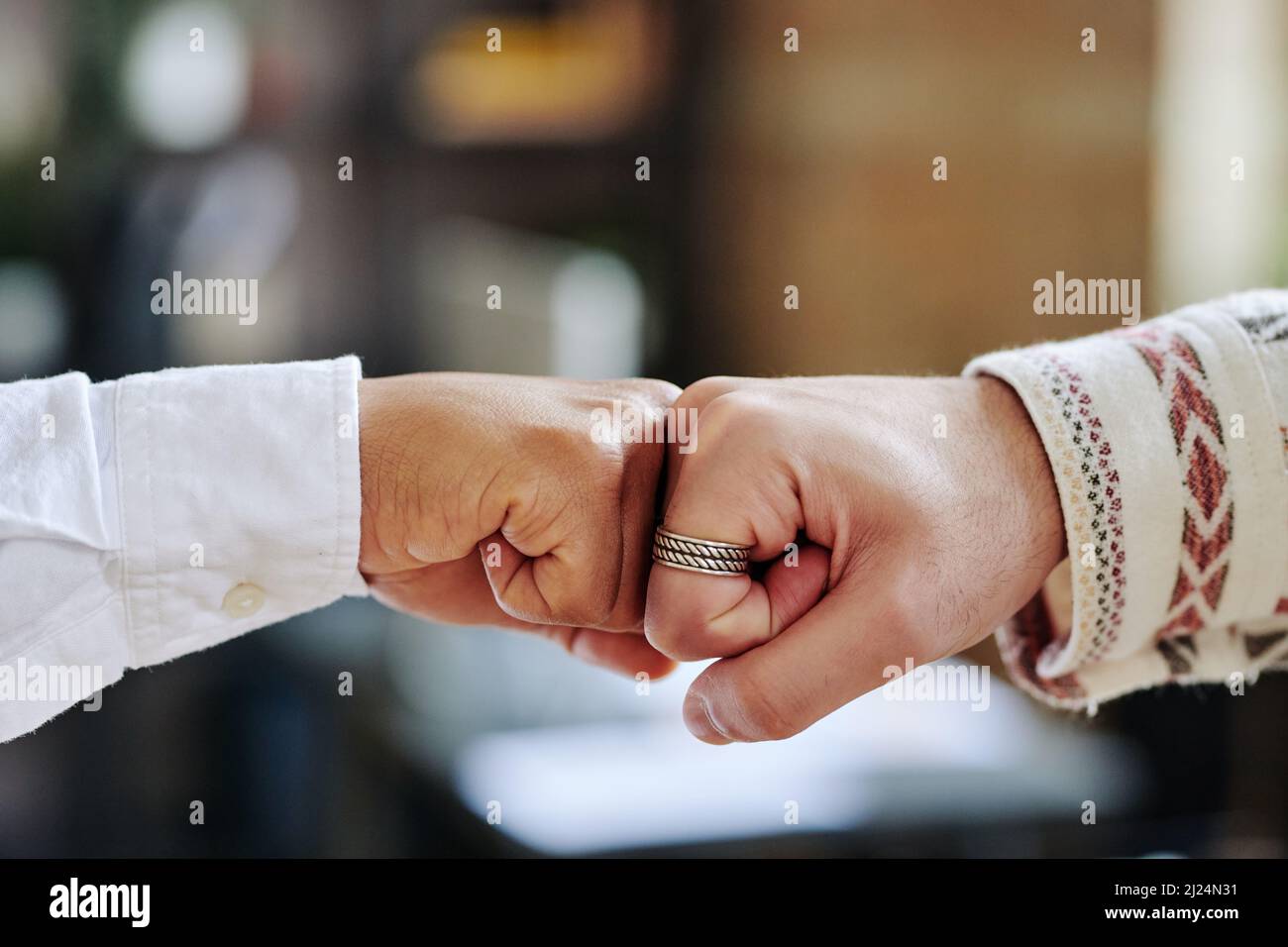 Close up punch bump hi-res stock photography and images - Alamy