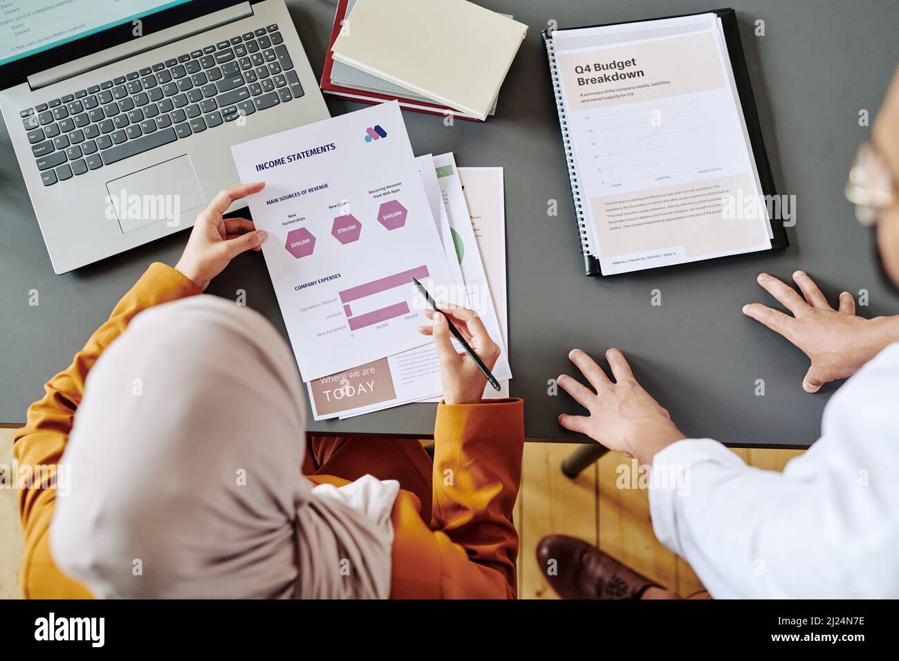 Young Muslim female accountant making presentation of financial report ...