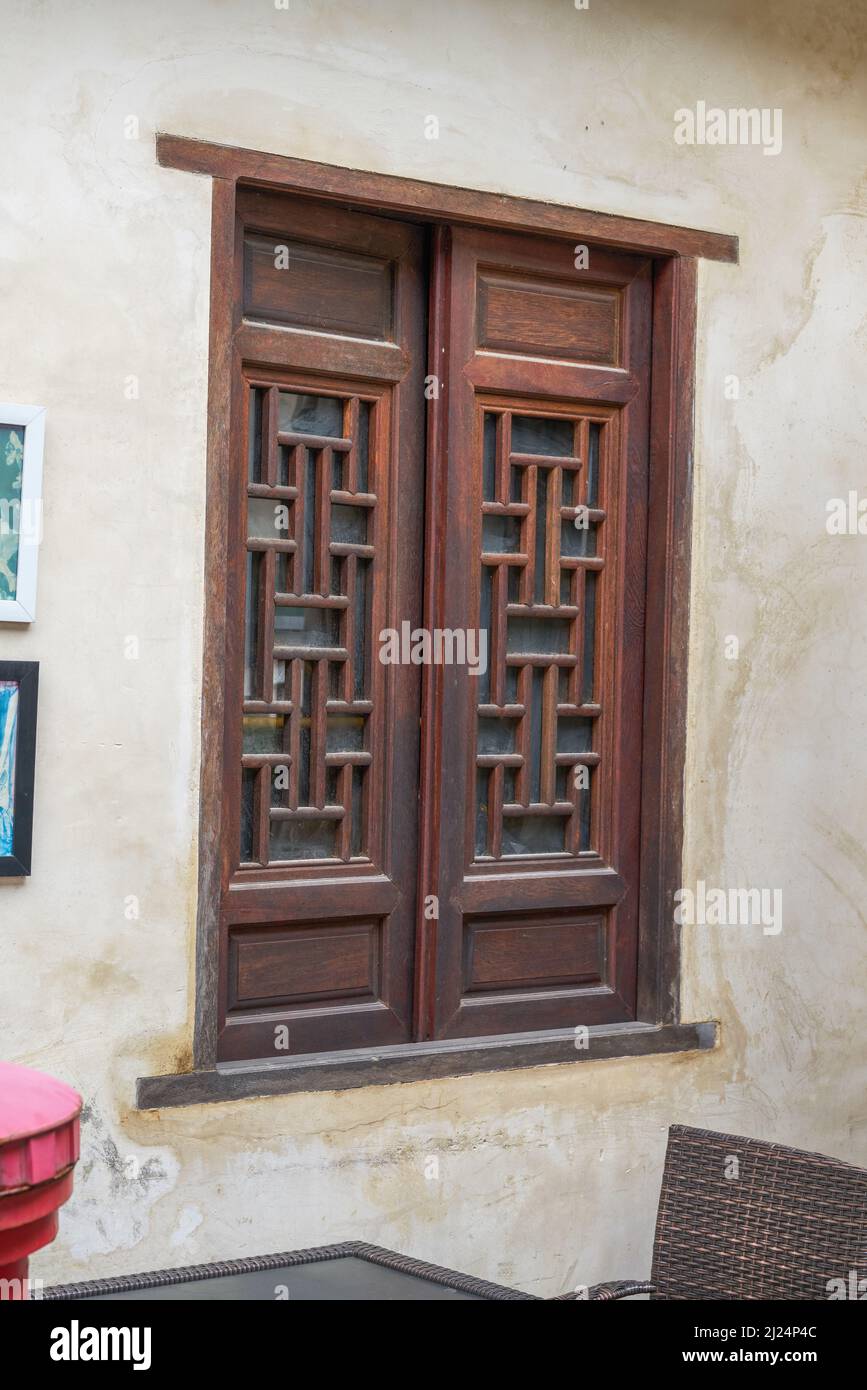 Close-up of traditional glass and wooden windows in ancient Chinese ...