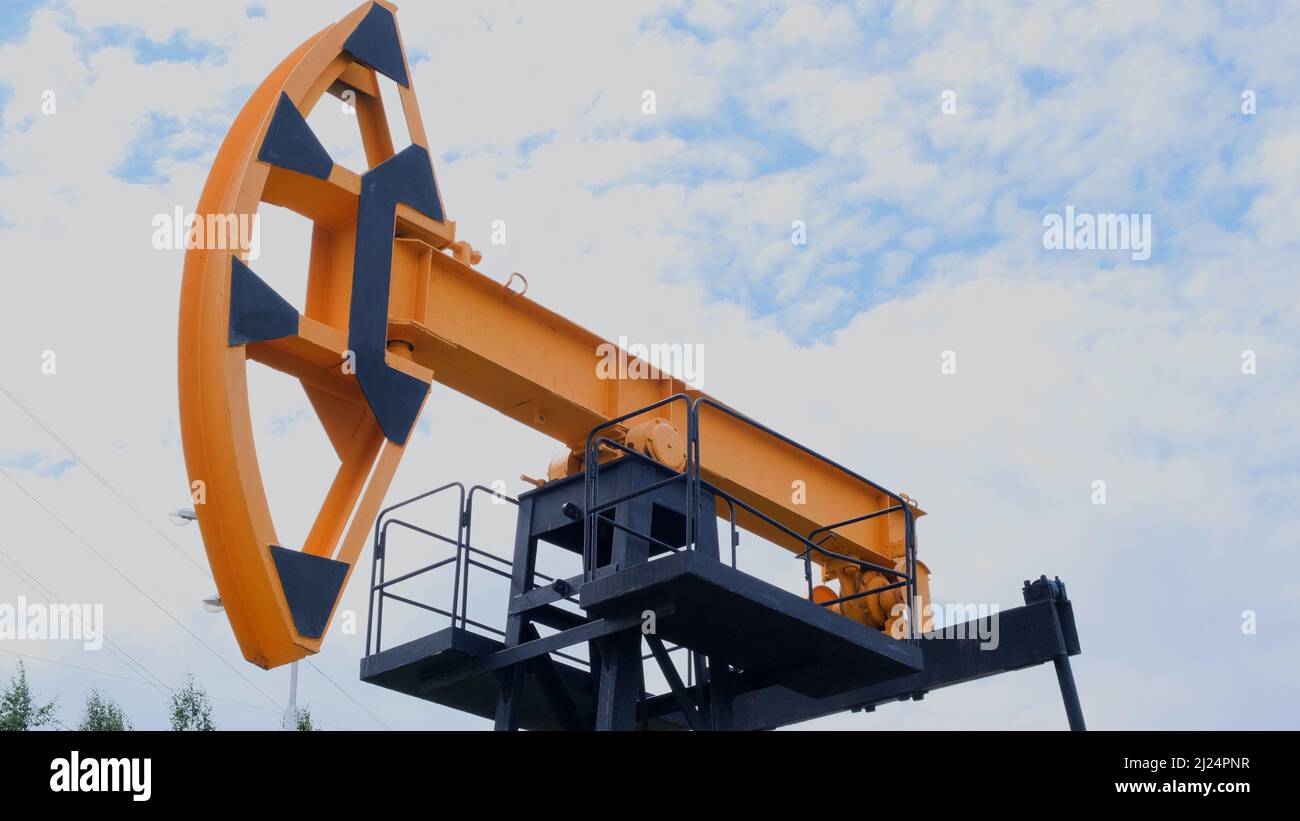 Oil and gas production equipment running on a summer day. The concept ...