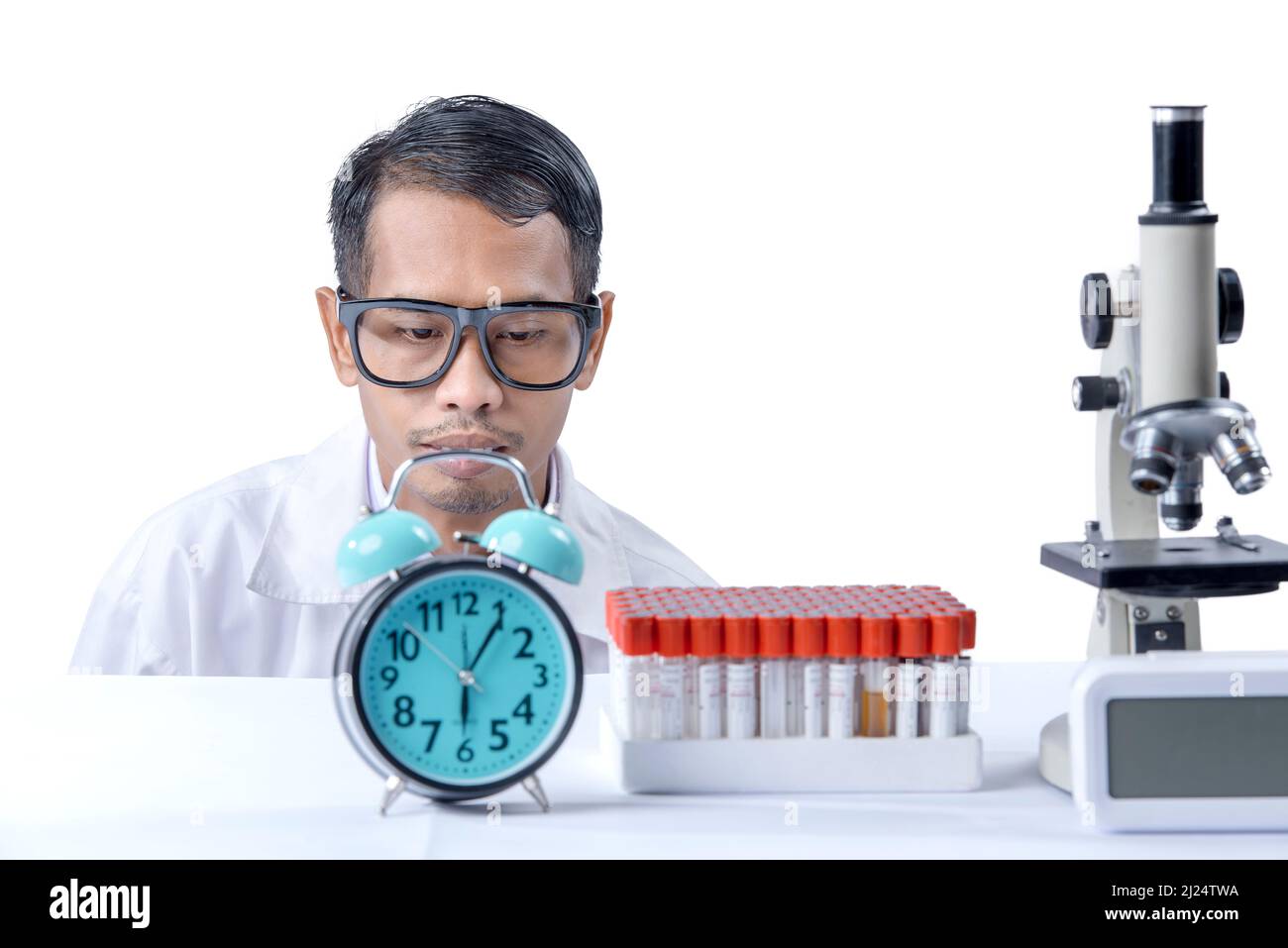 Asian nerd scientist with a microscope and medical tube rack on the ...
