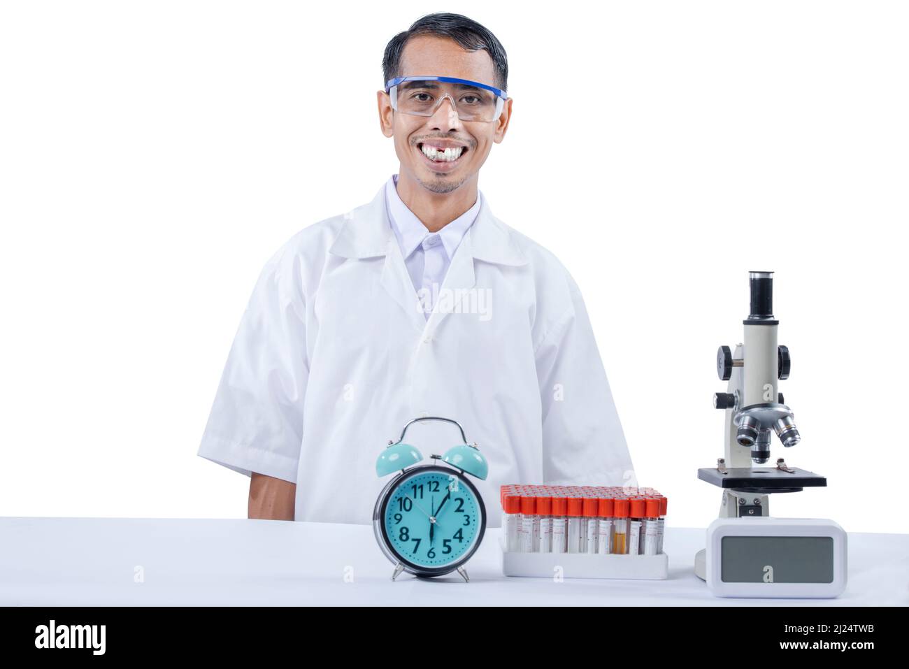 Asian nerd scientist standing with a microscope and medical tube rack ...