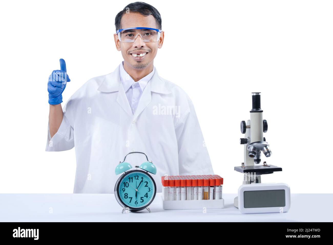 Asian nerd scientist standing and showing thumb up with a microscope ...