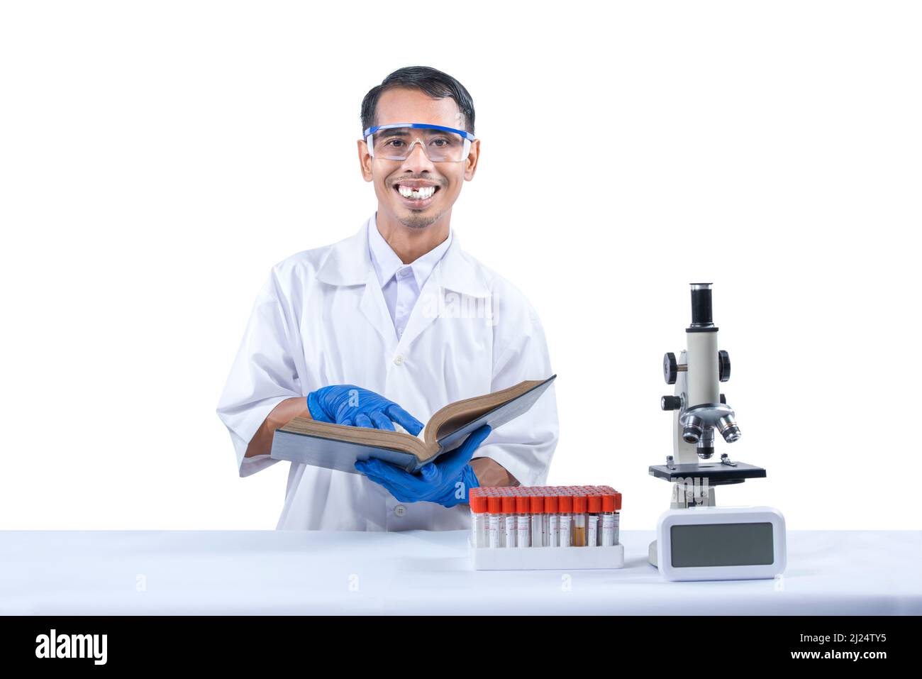 Asian nerd scientist standing and holding a book with a microscope and ...