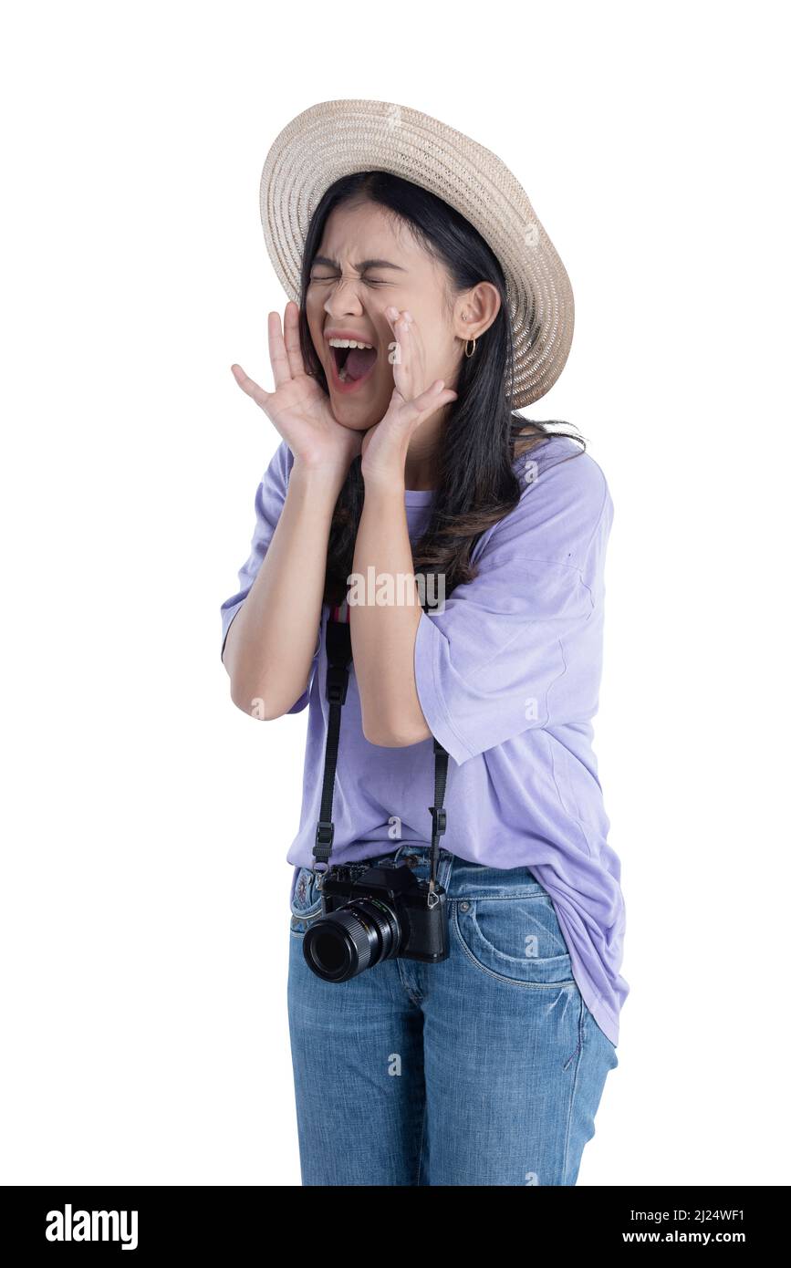 Asian woman with hat and camera yelling something isolated over white ...
