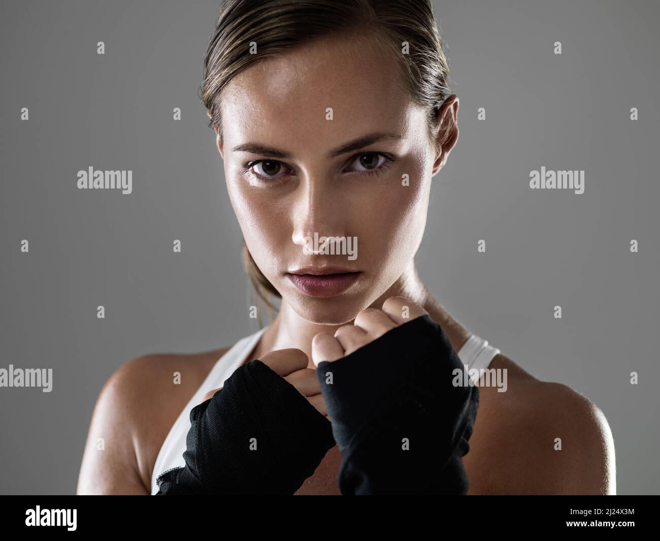 No pulling punches when it comes to working out. Cropped shot of an ...