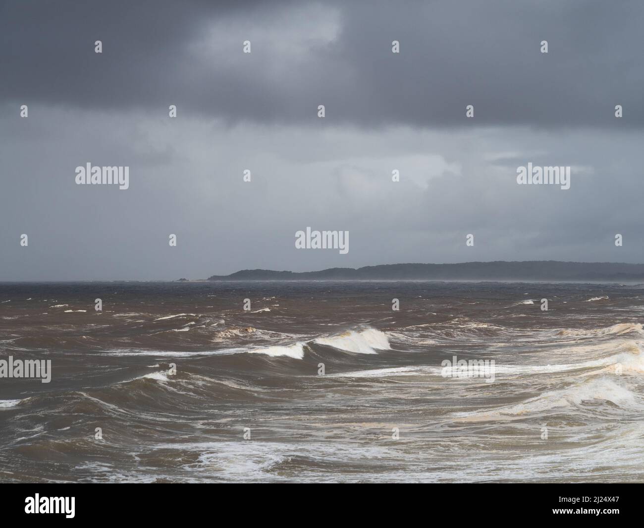 Stormy weather, Ocean waves rolling in, sea dirty and churning after ...