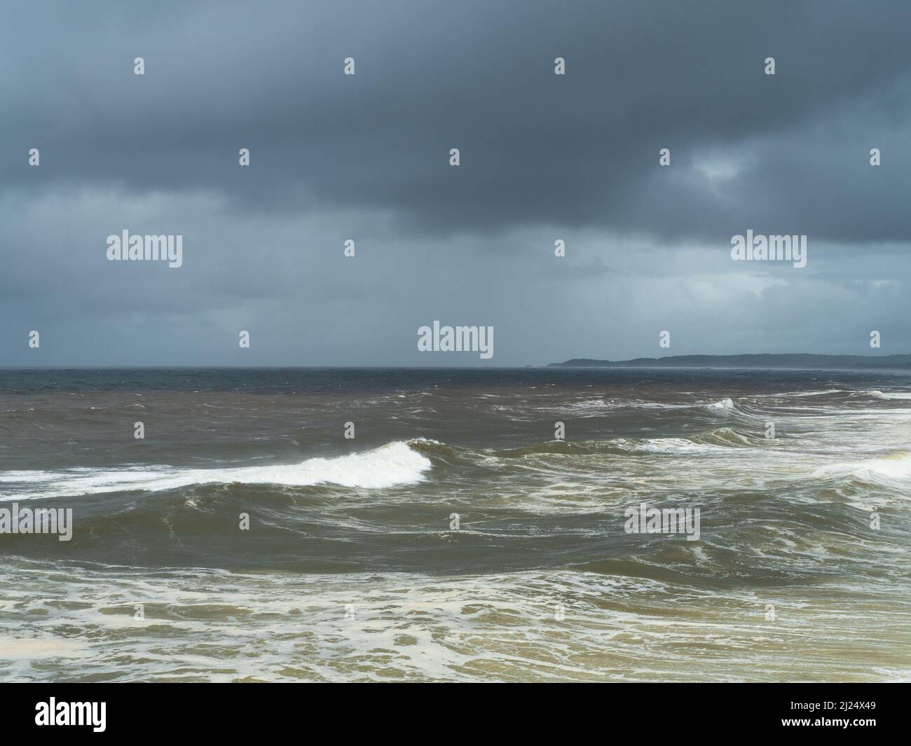 Stormy weather, Ocean waves rolling in, sea dirty and churning after ...