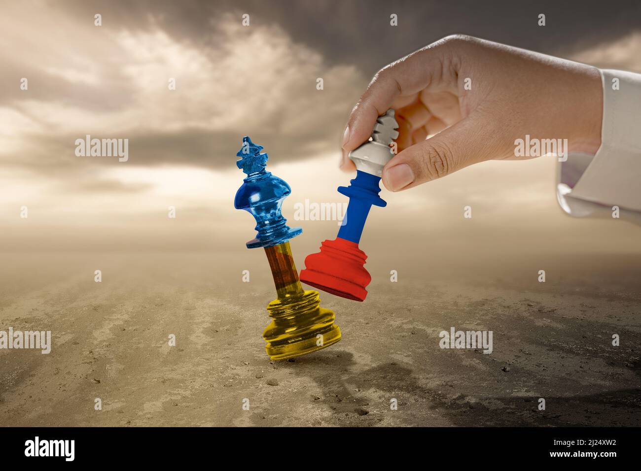Human hand holding chess piece king with Russian flag to beat chess ...