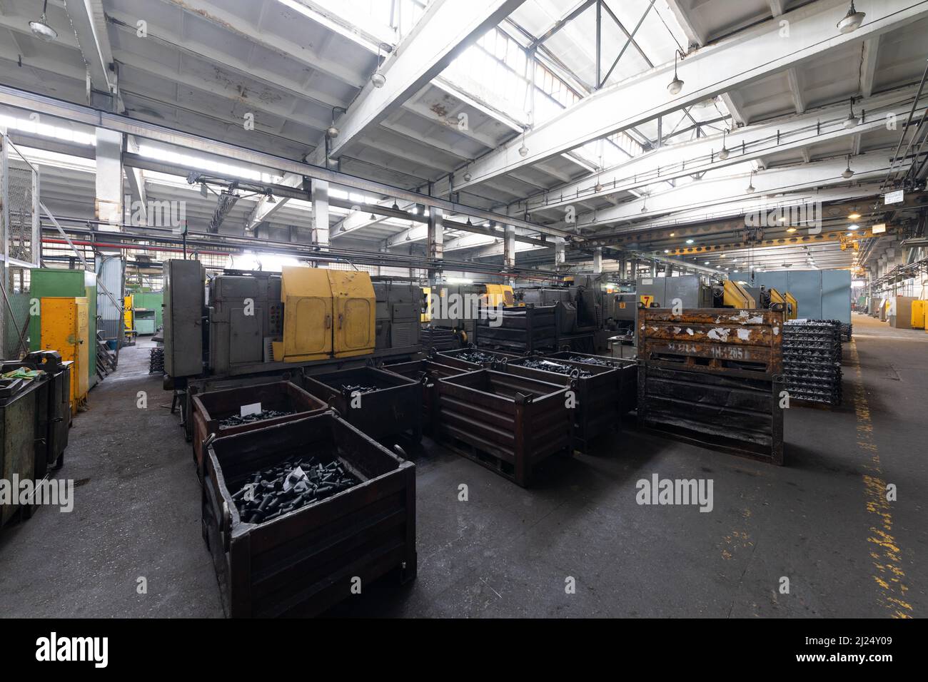 The interior of a big industrial building of factory with steel ...