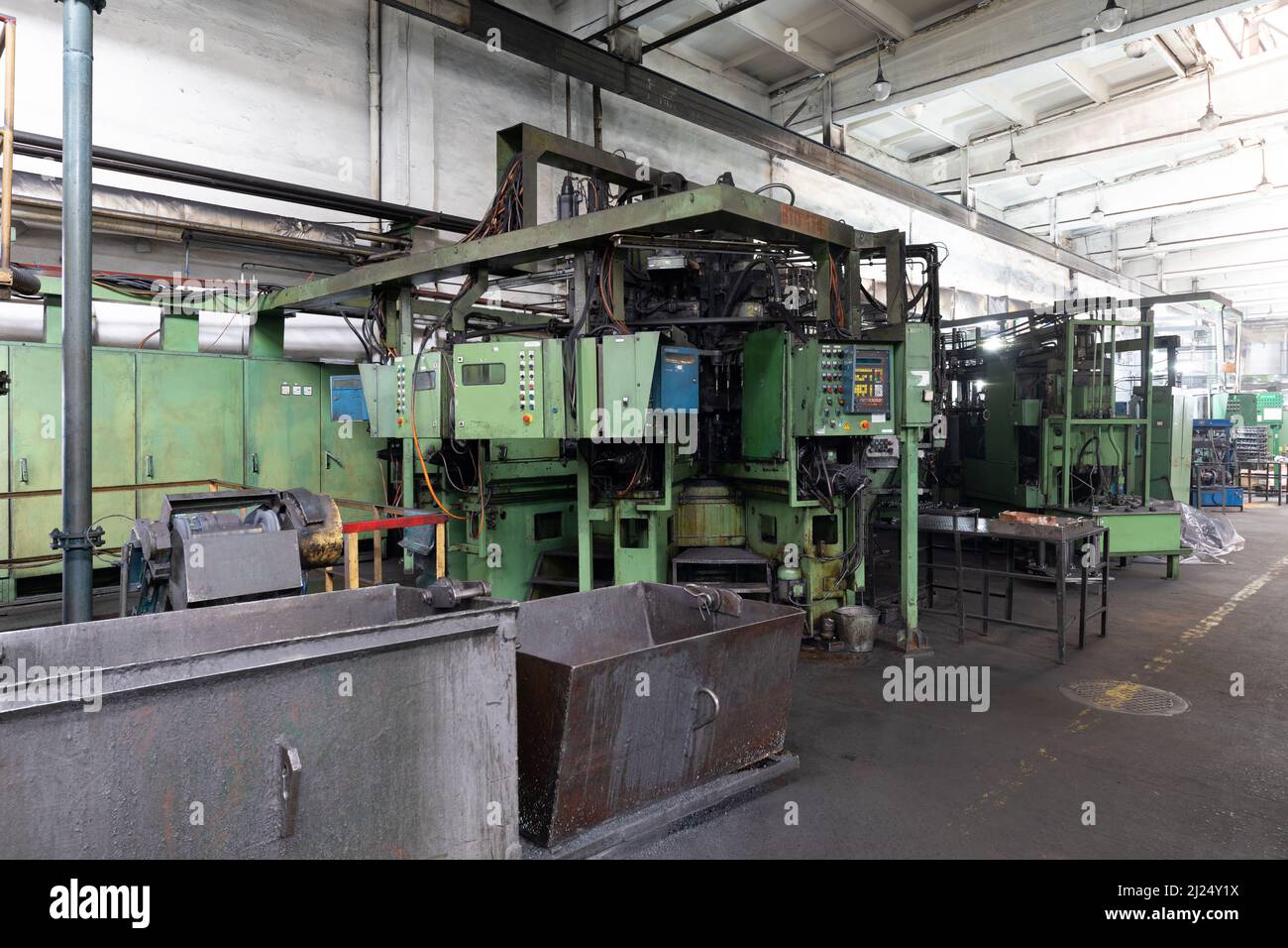 The interior of a big industrial building of factory with steel ...